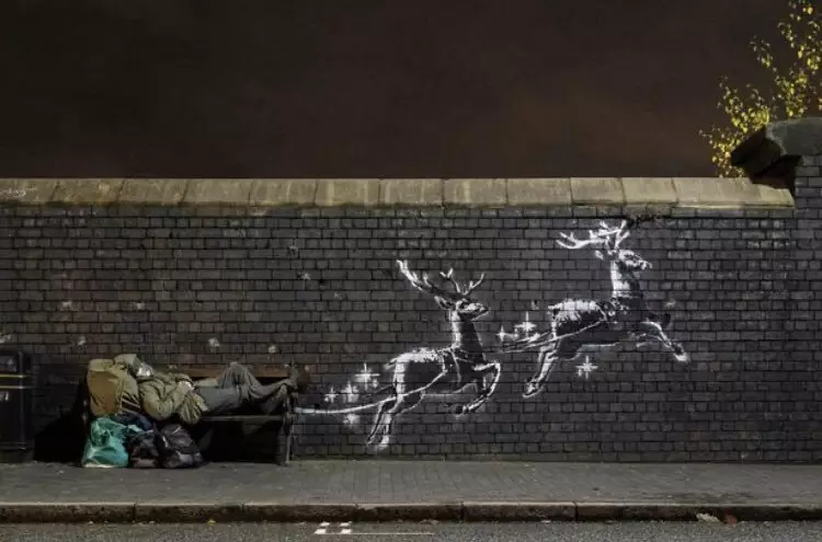 Grande Banksy Drew Graffiti de Natal. Seu personagem principal é um sem-teto Papai Noel